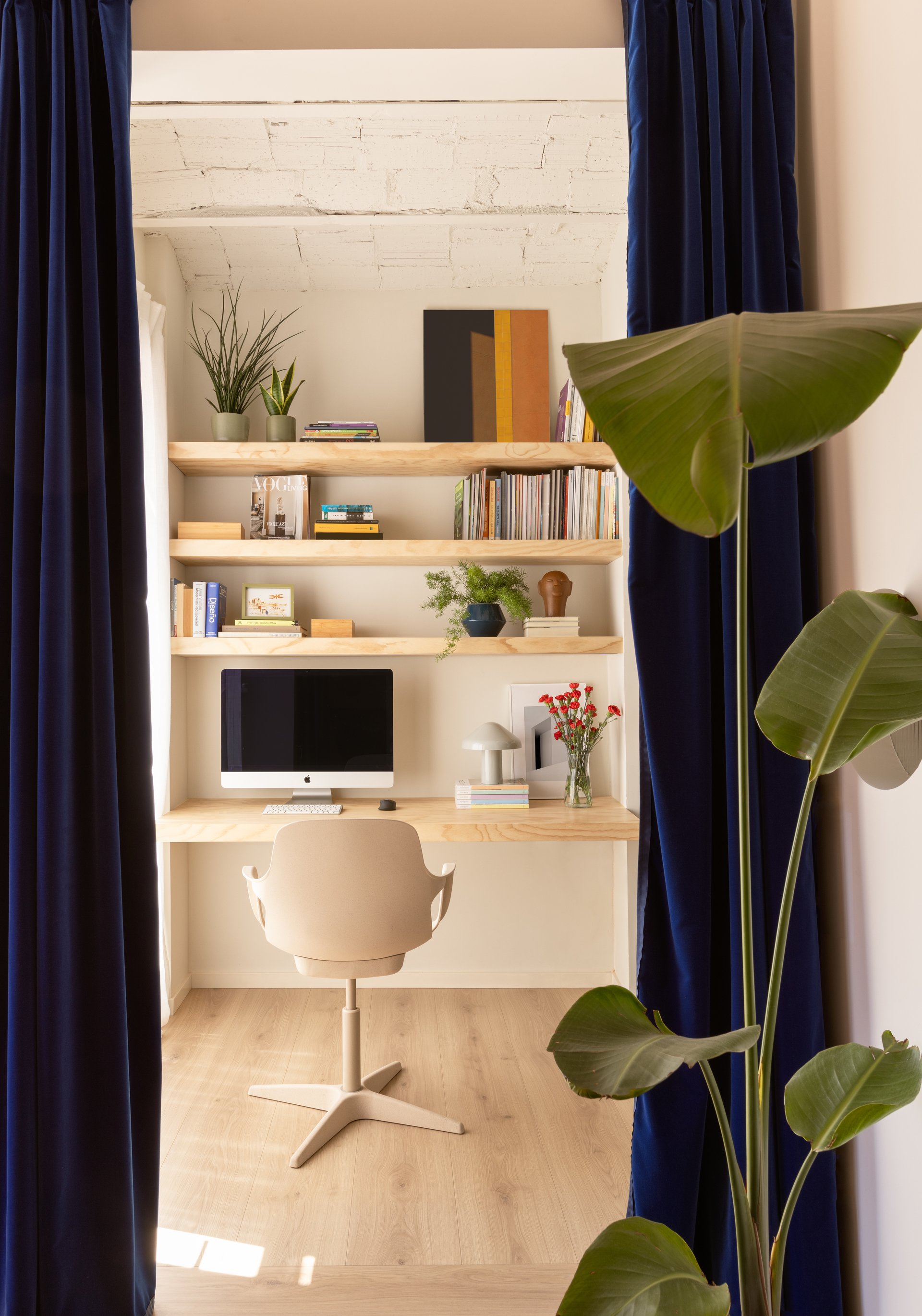 The pink entrance to a small apartment in Barcelona