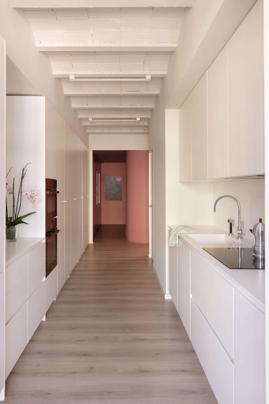 The pink entrance to a small apartment in Barcelona