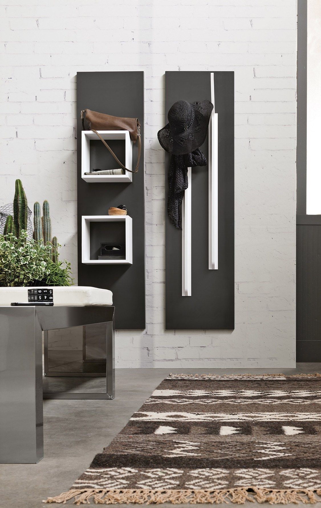 A magnetic wall system which can be fitted with shelves and accessories