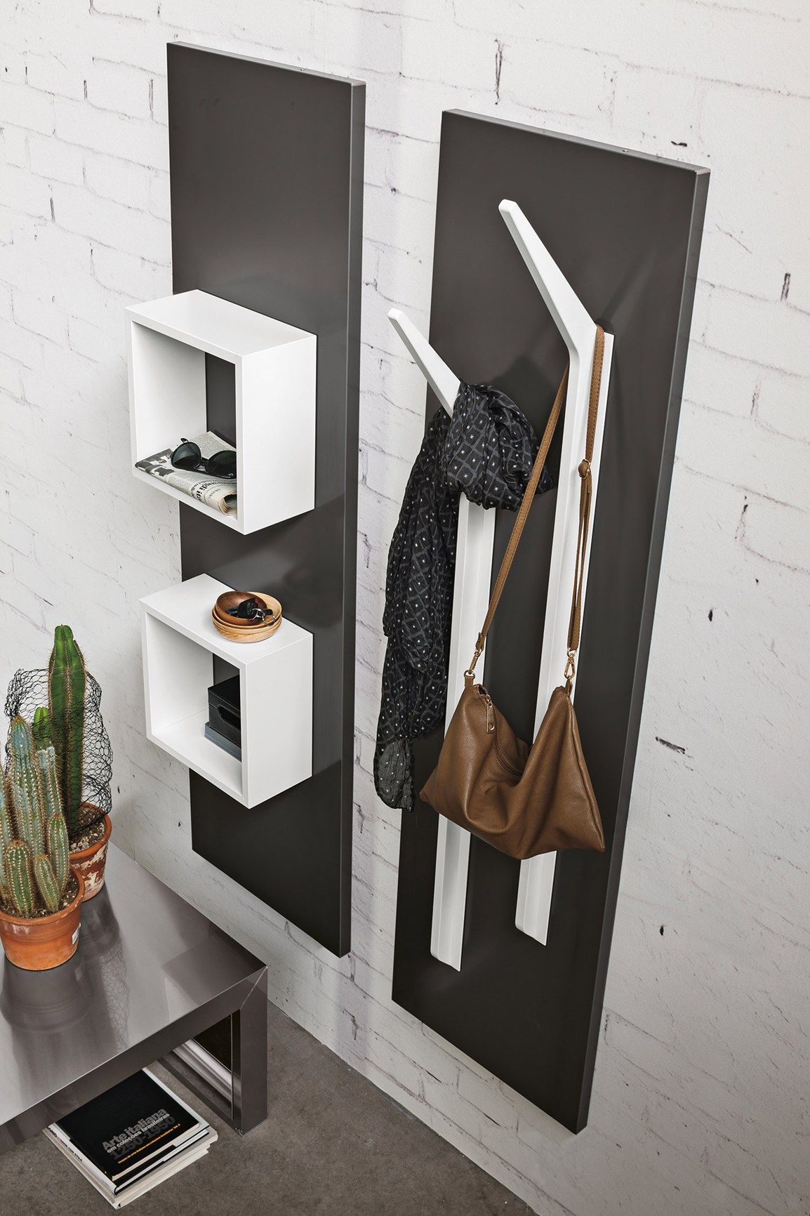 A magnetic wall system which can be fitted with shelves and accessories