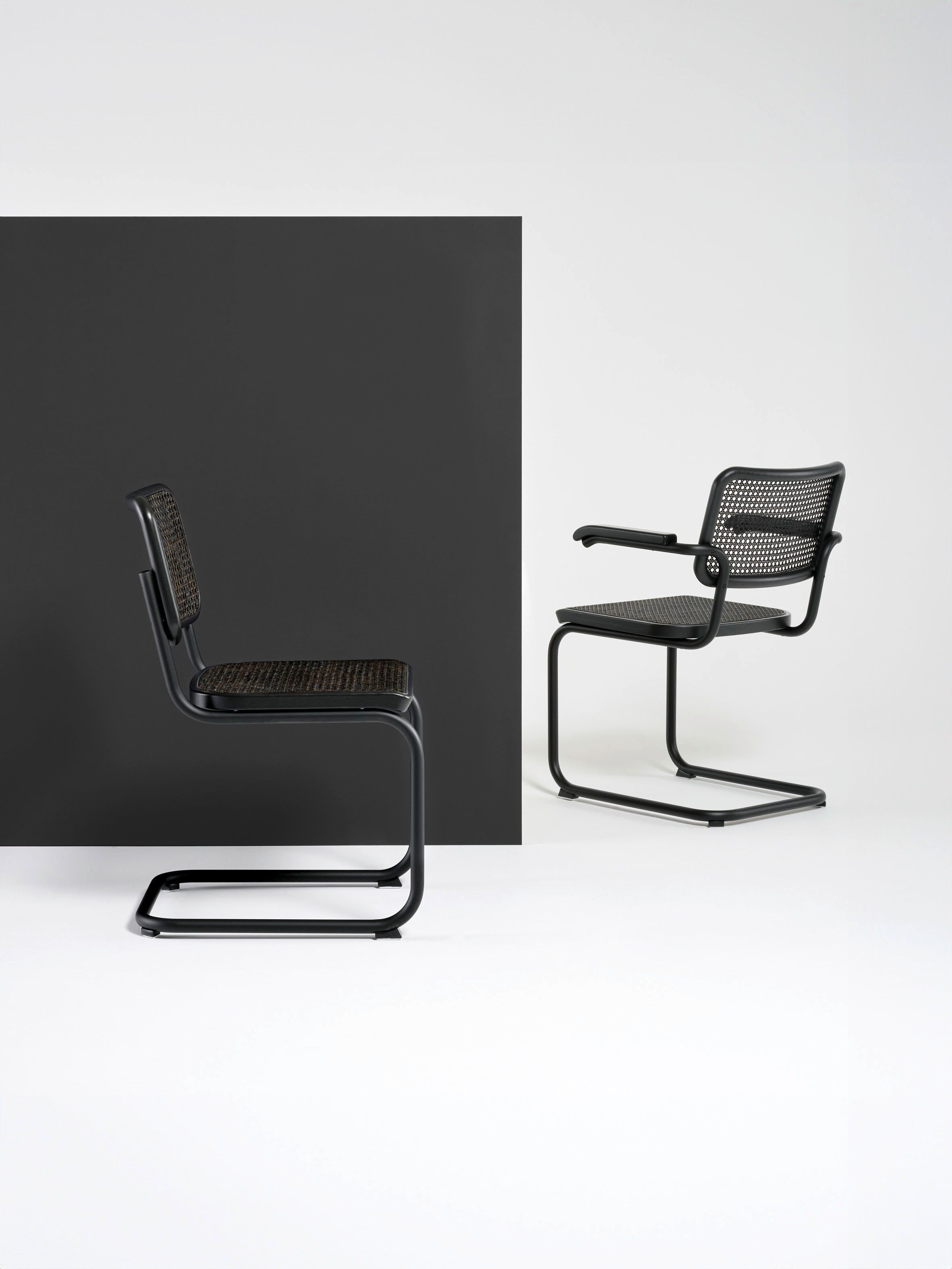 Thonet cantilever chair redesigned by Sebastian Hekner with dark canework