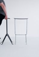 A system of forged iron legs supports surfaces of different sizes and ...