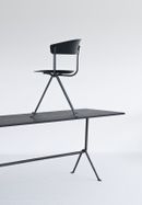 A system of forged iron legs supports surfaces of different sizes and ...