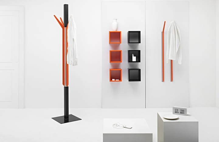 A magnetic wall system which can be fitted with shelves and accessories