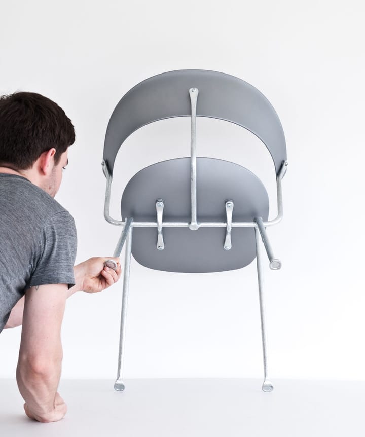 A system of forged iron legs supports surfaces of different sizes and ...