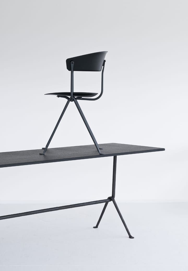 A system of forged iron legs supports surfaces of different sizes and ...