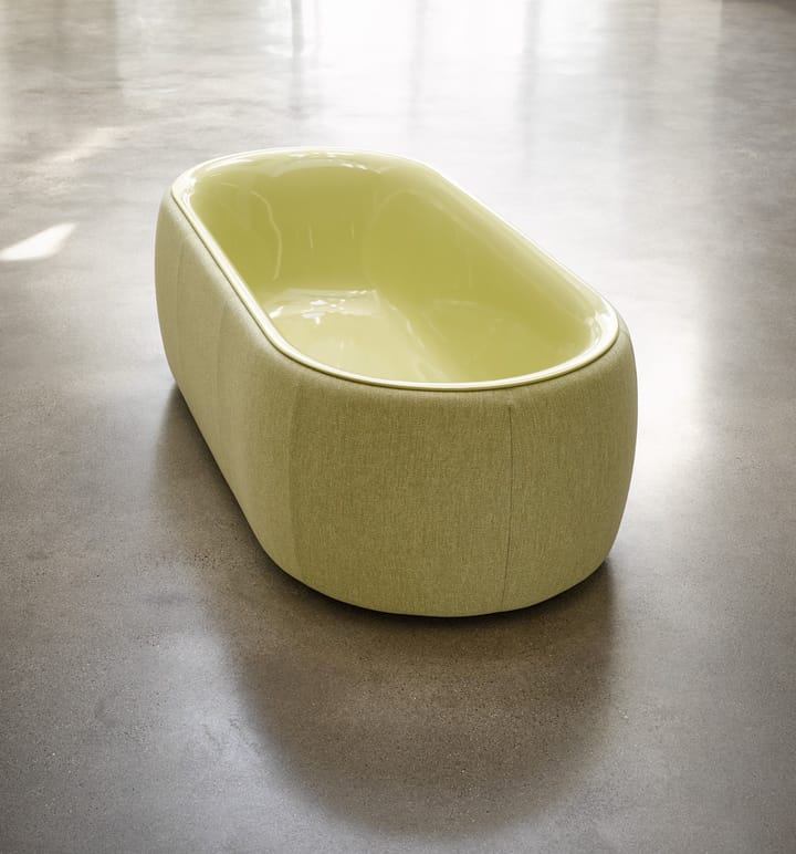 The bathtub is dressed in fabric