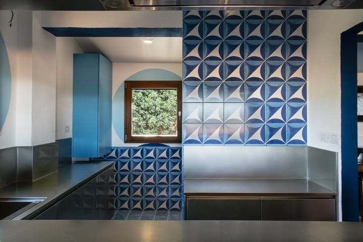 The stainless steel of the Abimis kitchen looking out to sea