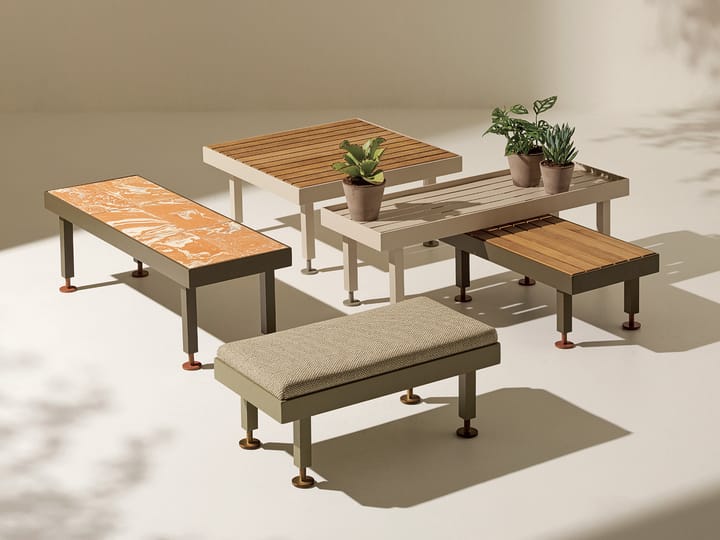 Ethimo outdoor tables and benches designed by Cristina Celestino