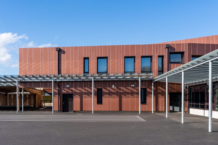 Carea mineral composite cladding for a Passivhaus school
