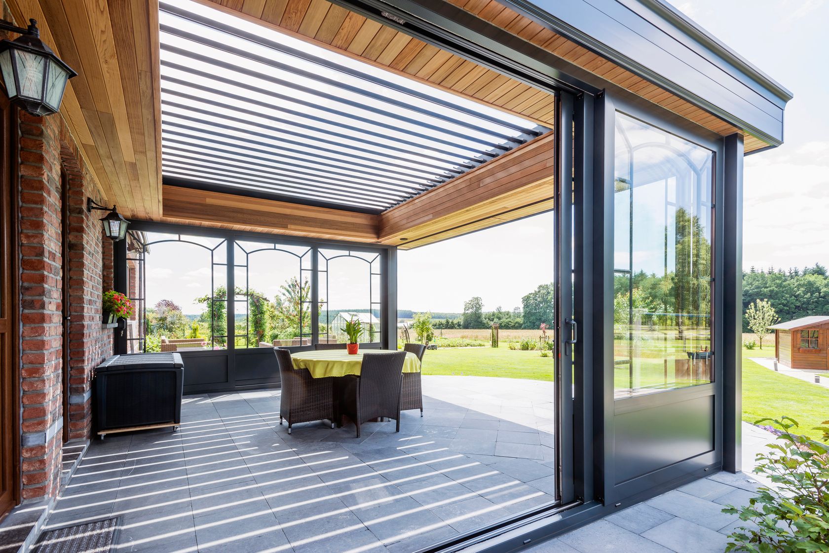 Motorized pergola with adjustable louvers AERO® By RENSON