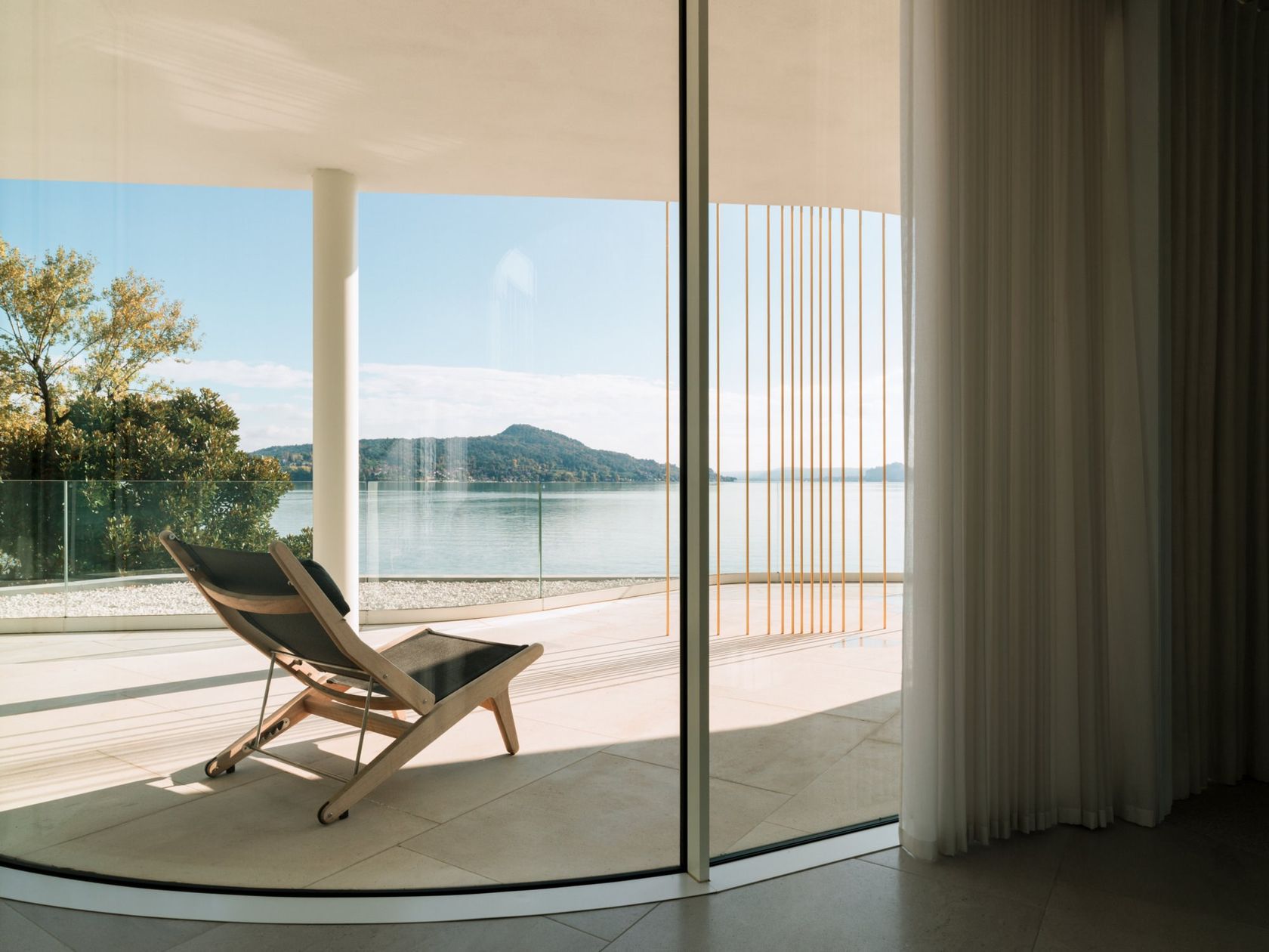 ARC Curved glass and aluminium sliding window By Sky-Frame