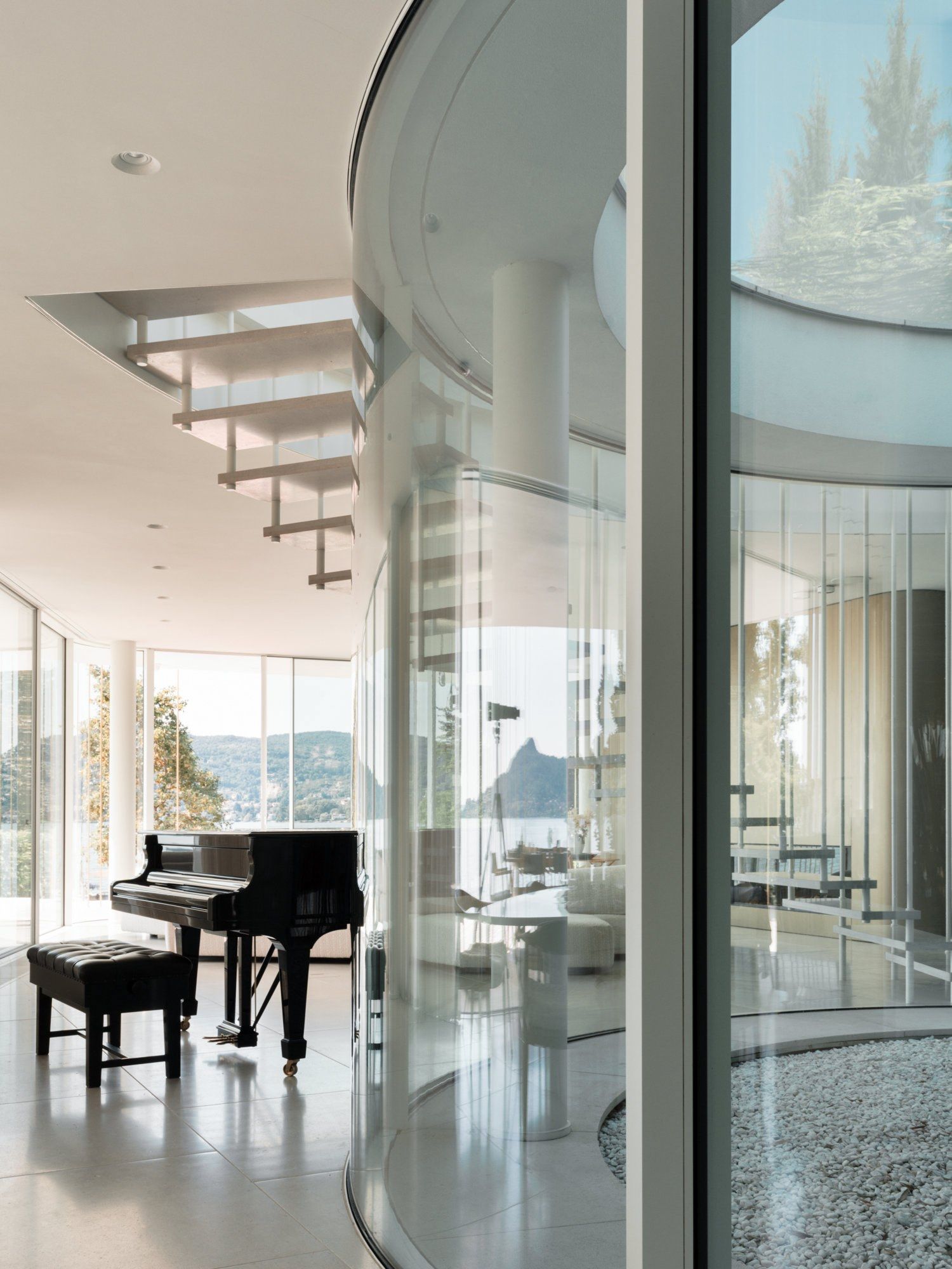 Curved glass and aluminium sliding window ARC By Sky-Frame