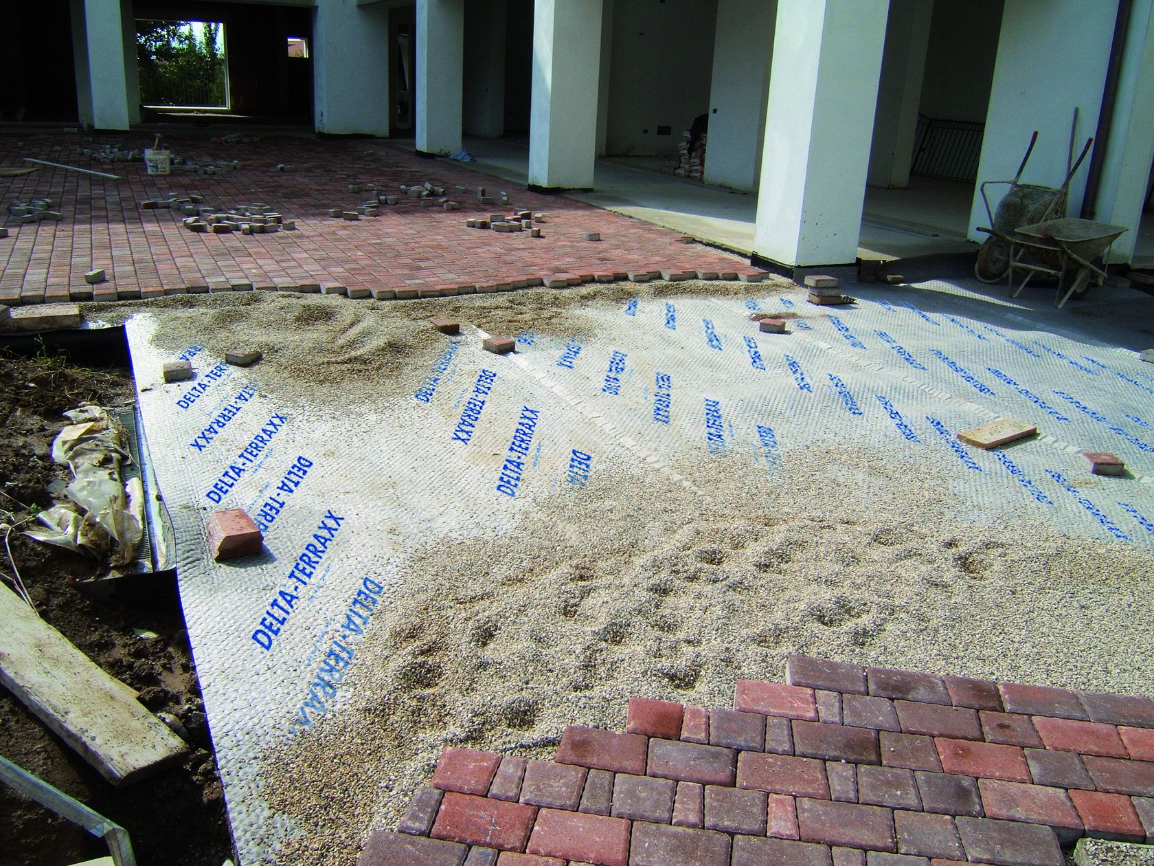 Earth retaining wall drainange and protection system DELTA® - TERRAXX ...