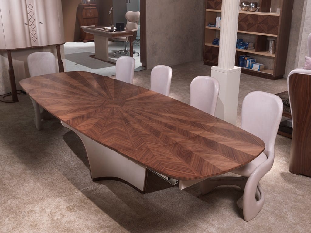 DESYO Oval walnut table By Carpanelli