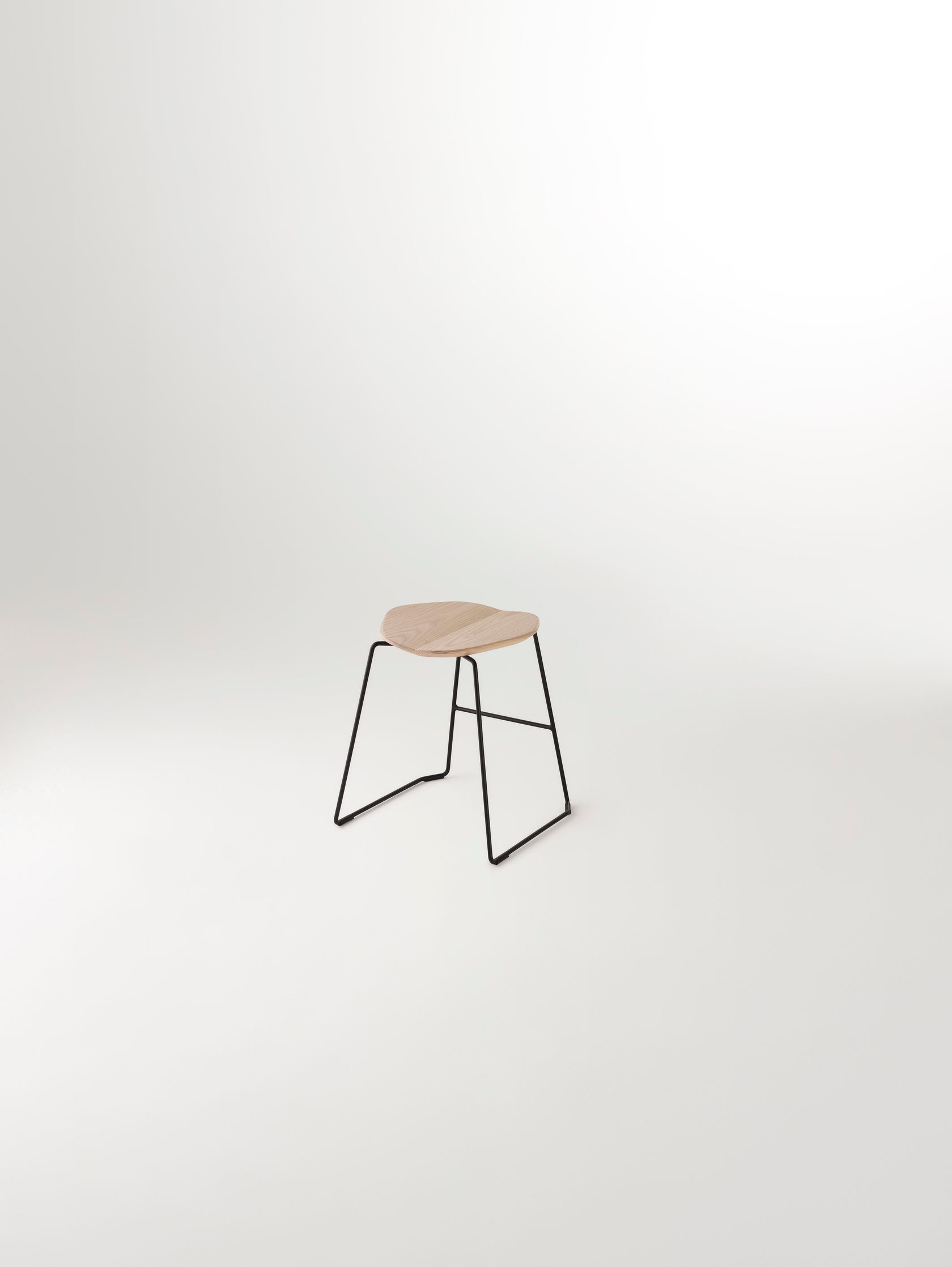 DUET | Low stool Sled base low stool with footrest By Ross Gardam