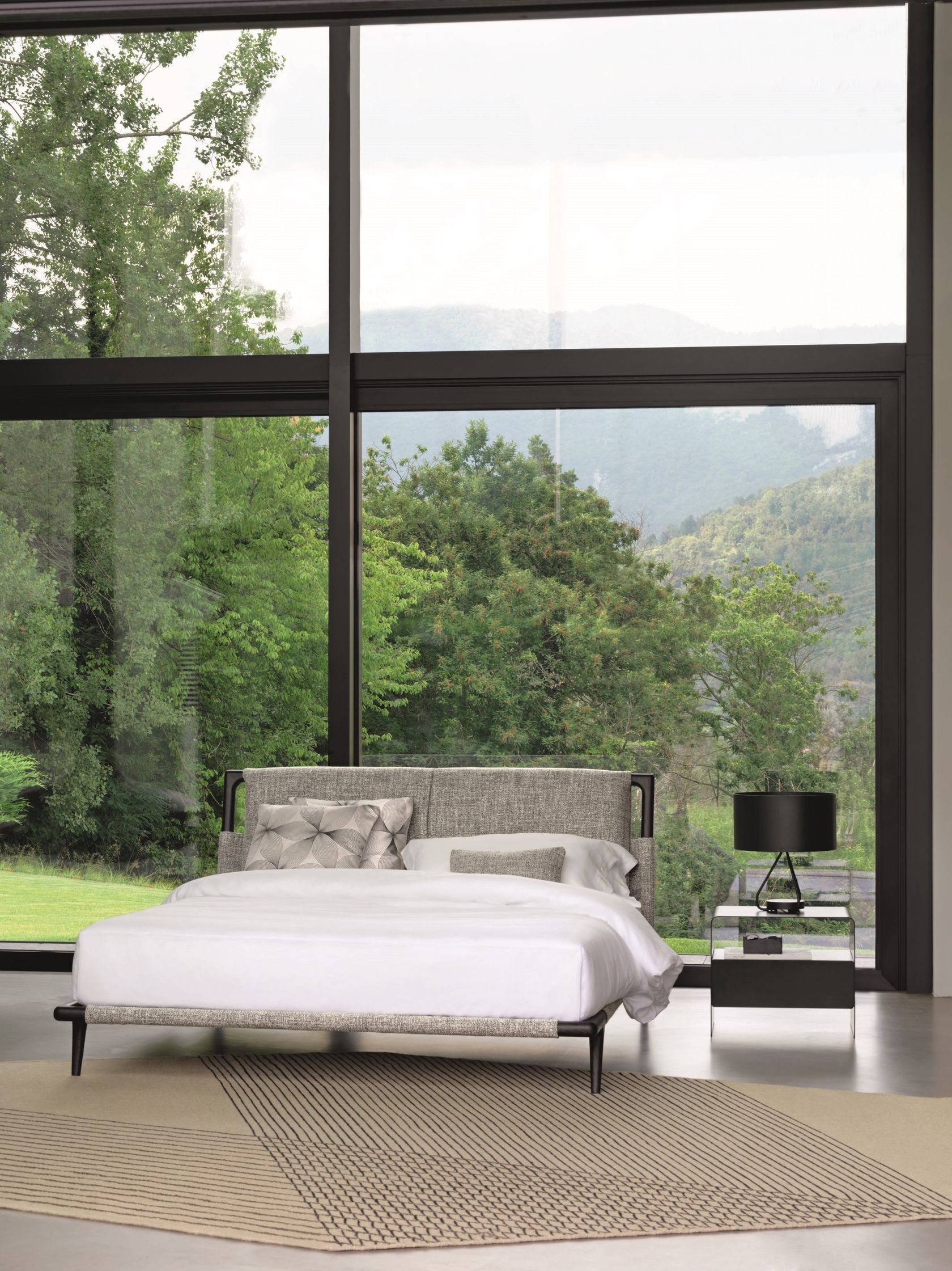 GAUDÍ Double bed with upholstered headboard By Flou