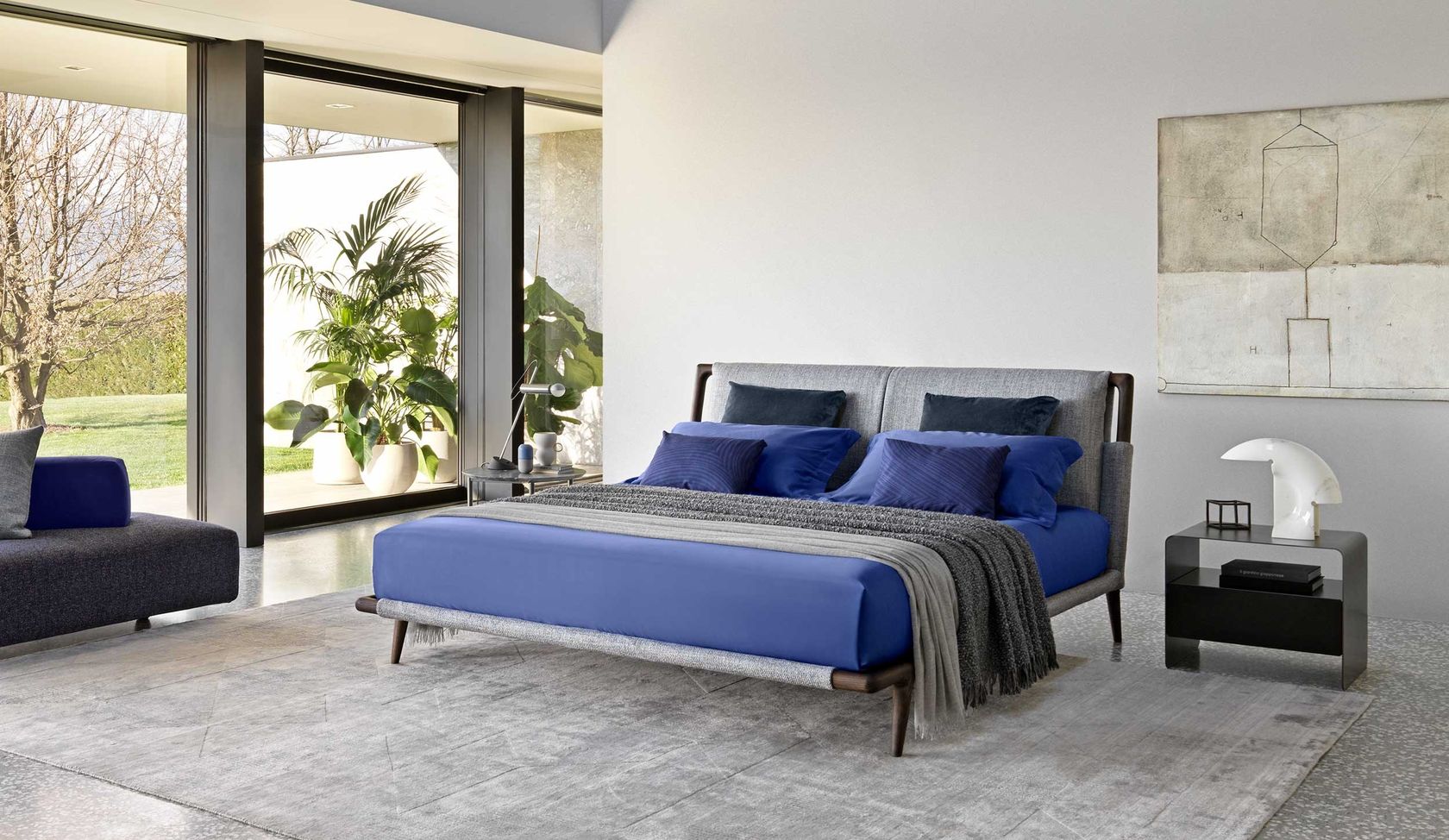 GAUDÍ Double bed with upholstered headboard By Flou