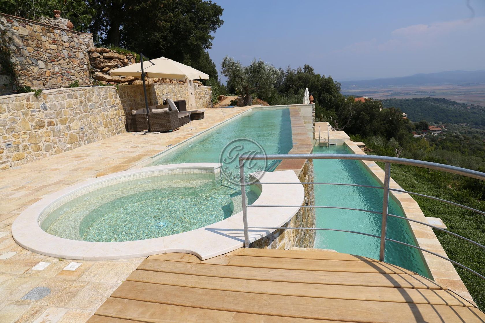 Infinity natural stone swimming pool with waterfall Swimming pool 18 By ...