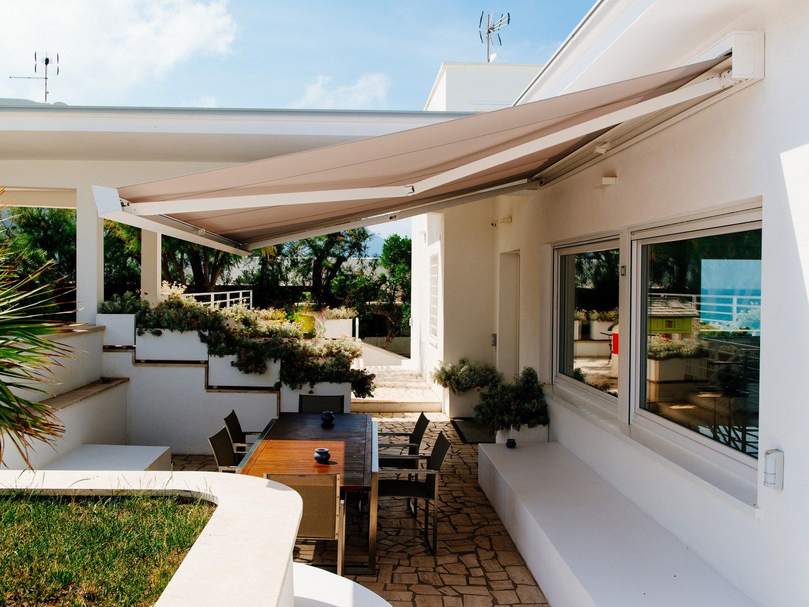 BOX AWNINGS Box motorized Folding arm awning By KE Outdoor Design