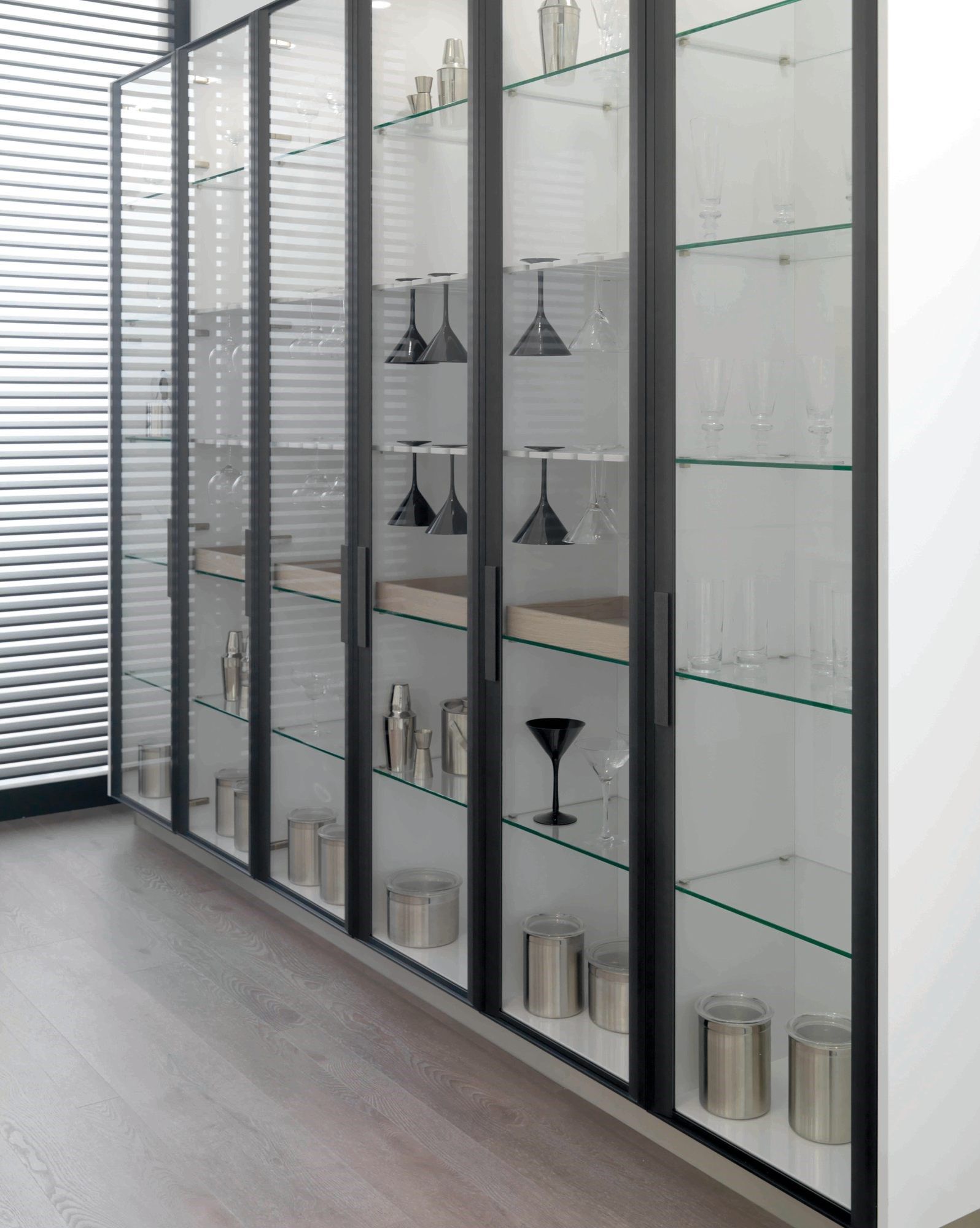 Contemporary style wood-product fitted kitchen with integrated handles ...