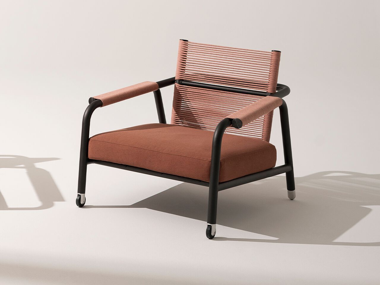 ASTRA Fabric garden armchair with armrests By RODA | design Rodolfo Dordoni