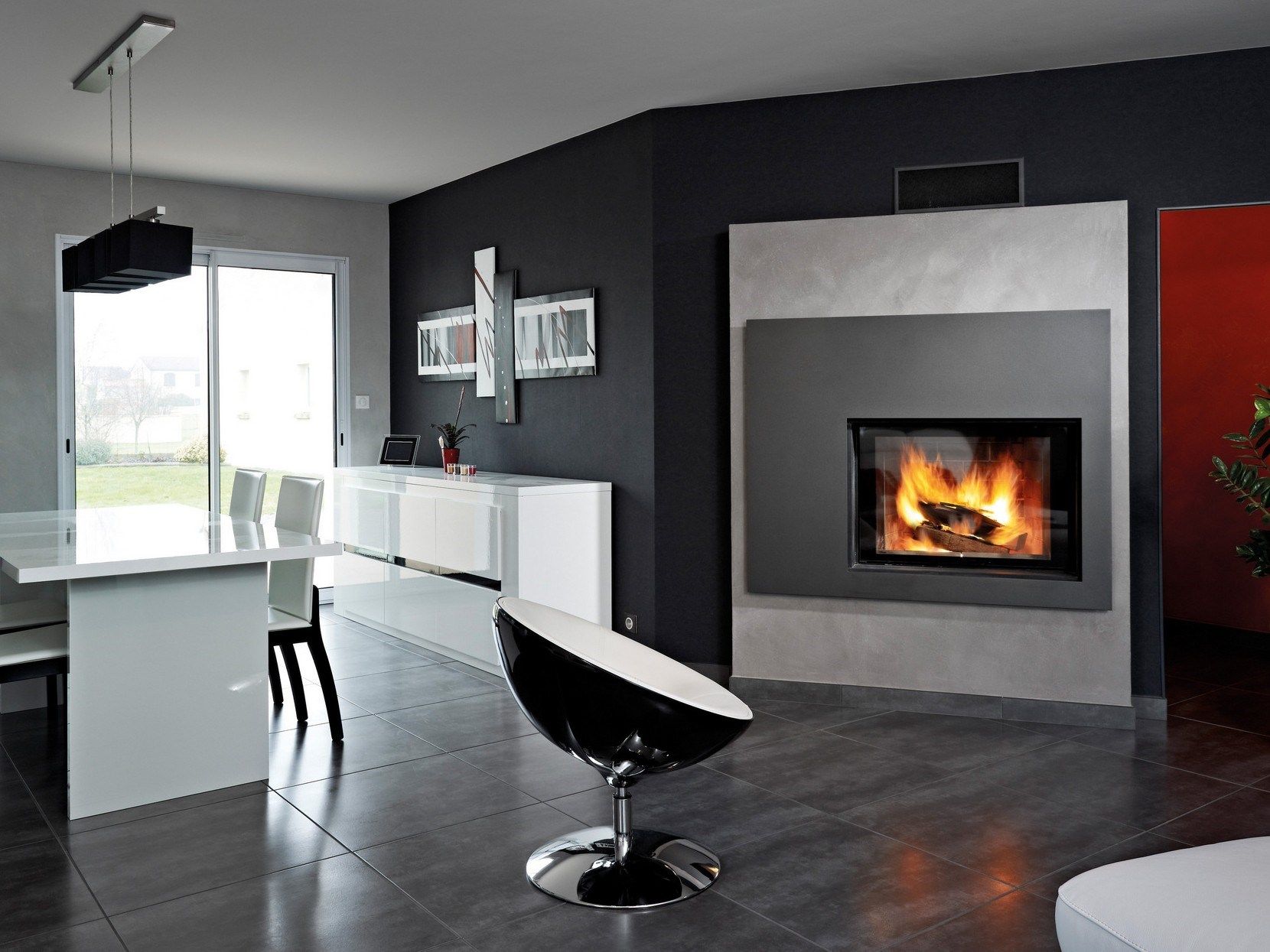 Wood-burning steel fireplace with panoramic glass URANUS By RÜEGG