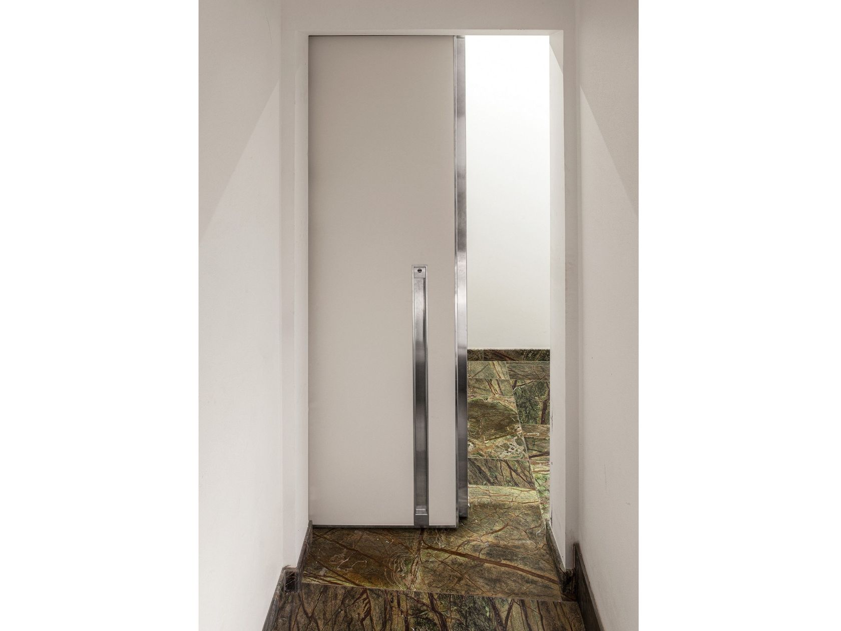 VELA Motorized sliding armored door By Oikos