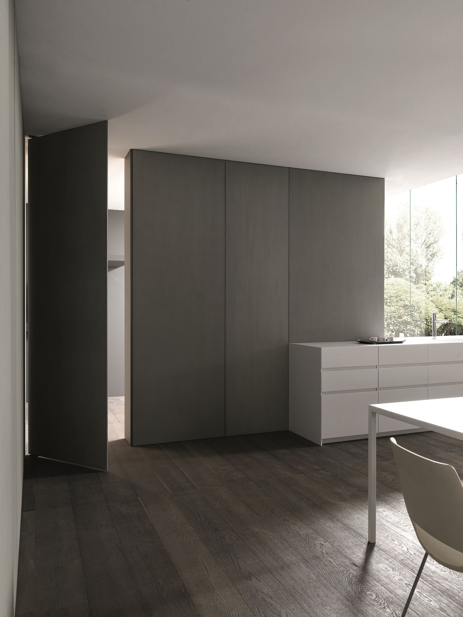 FLY Corian® kitchen with peninsula By MODULNOVA | design Andrea Bassanello