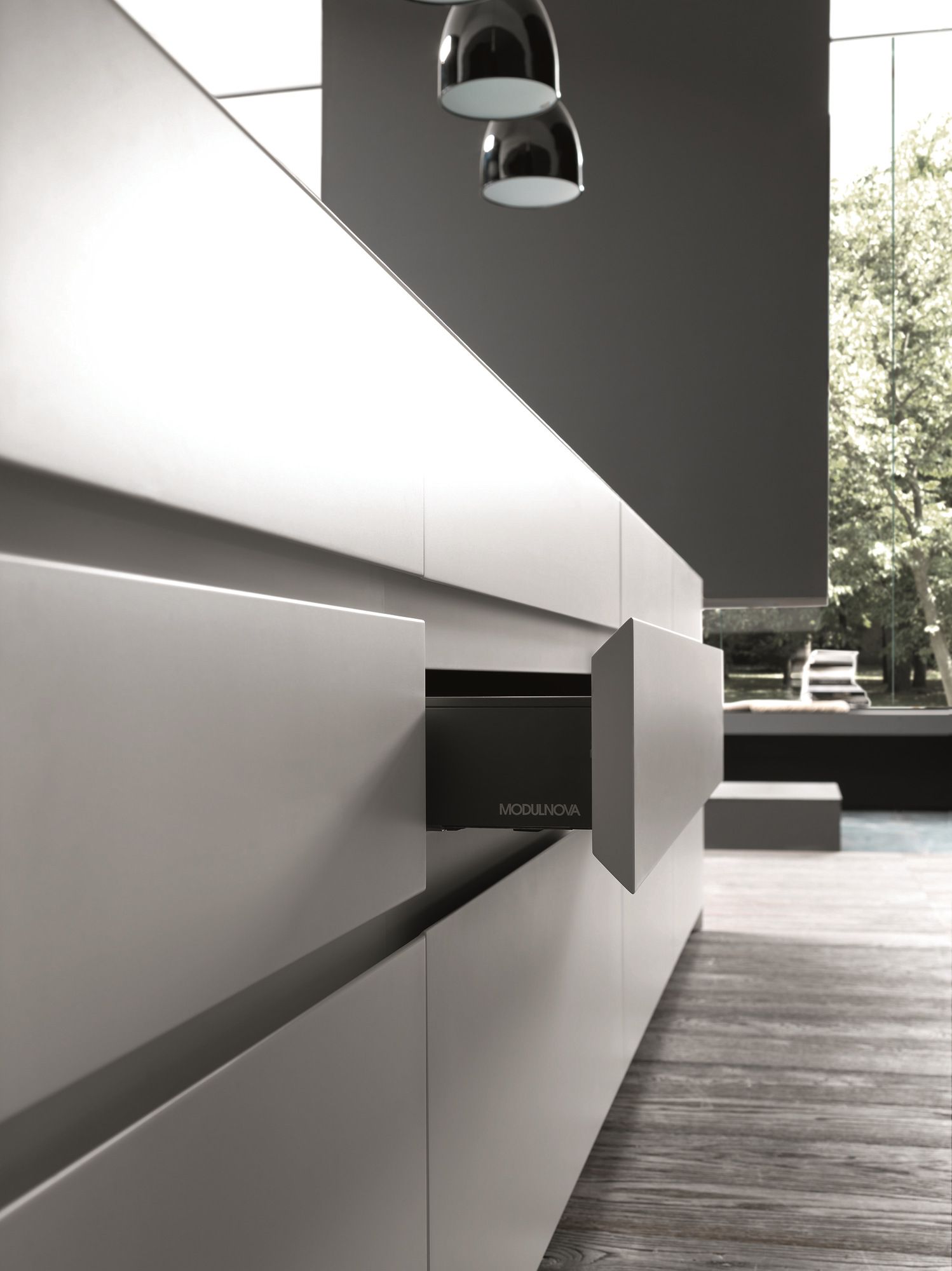 FLY Corian® kitchen with peninsula By MODULNOVA | design Andrea Bassanello