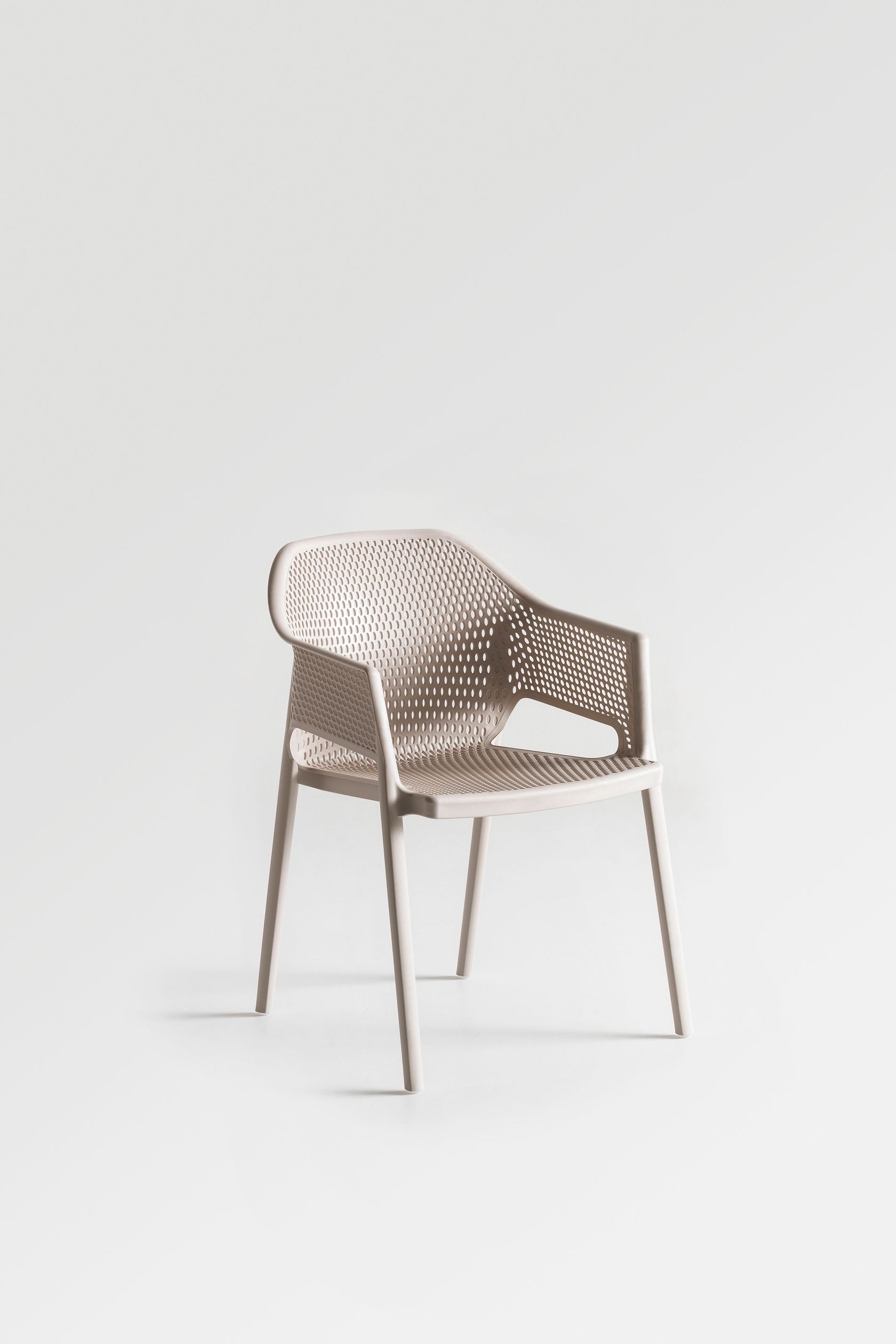 MINUSH Stackable technopolymer chair with armrests By GABER | design Eurolinea