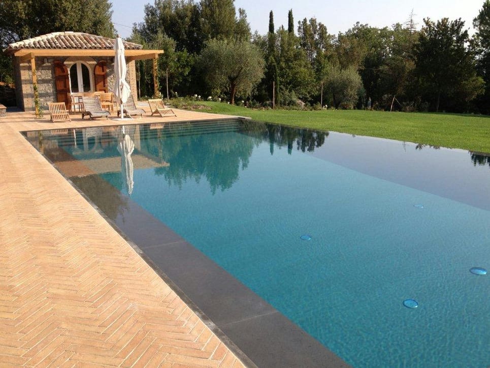 Infinity swimming pool Infinity swimming pool with waterfall By INDALO ...