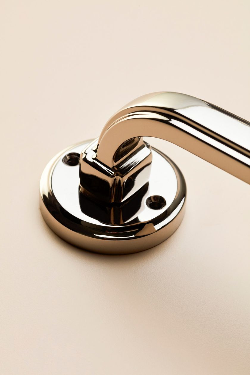 Brass door handle on rose AURORA By Dnd