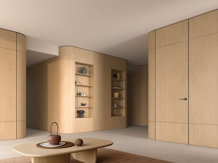 Curved wall paneling with integrated flush door Boiserie By BARAUSSE