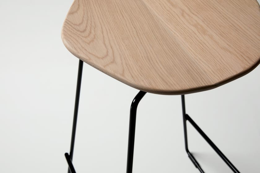 DUET | Low stool Sled base low stool with footrest By Ross Gardam