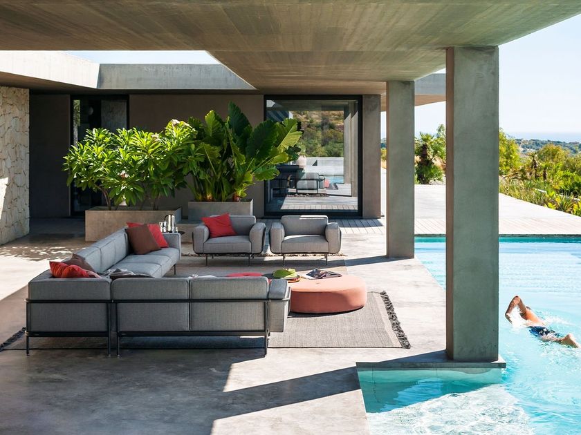 ESTENDO Fabric garden armchair with armrests By RODA | design Luca Pevere