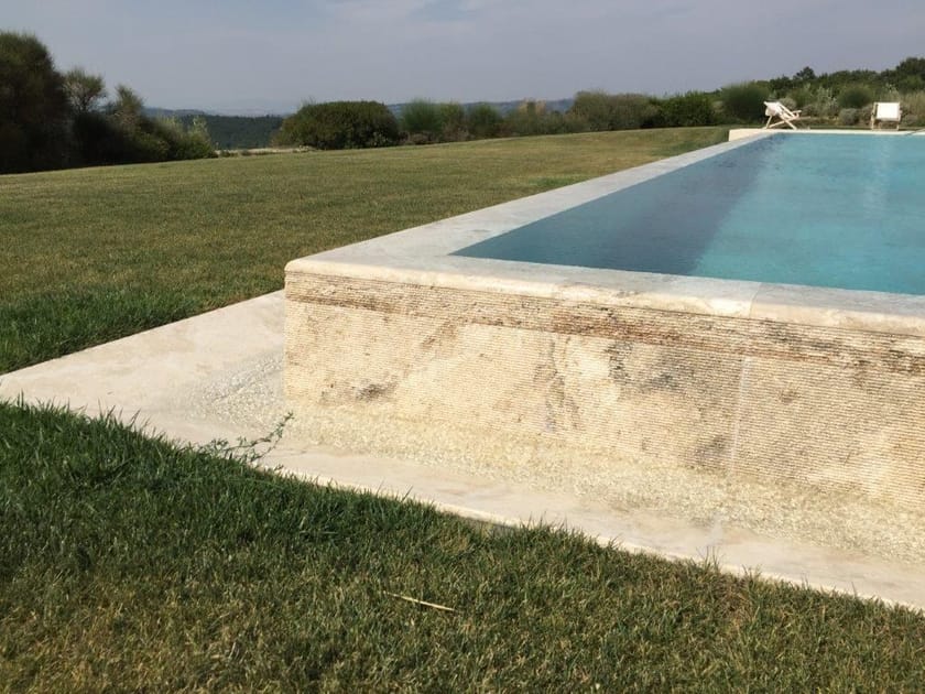 Infinity swimming pool Infinity travertine swimming pool with waterfall ...
