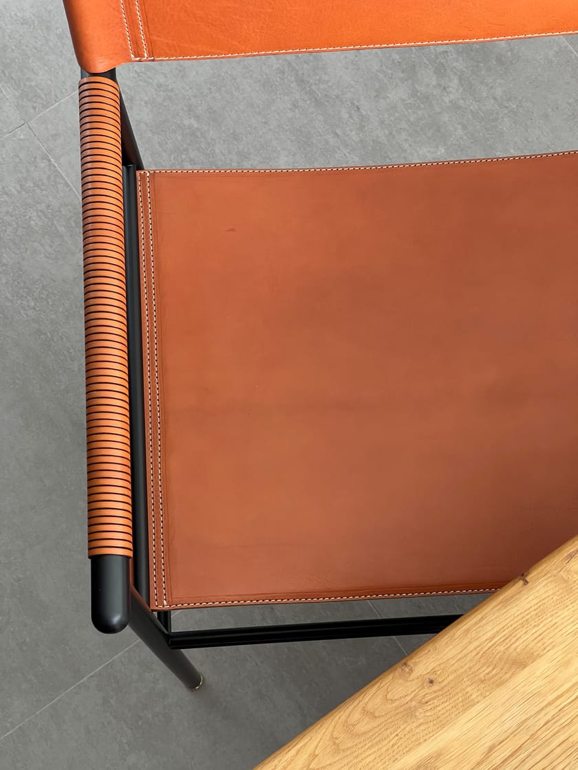 REPOSE | Chair Tanned leather and steel chair with armrests By Jover+Valls