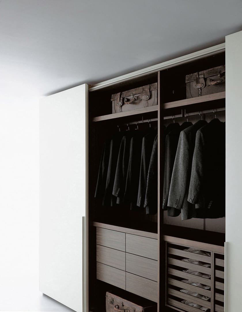 STORAGE SLIDING Sectional wardrobe with sliding doors custom By Porro ...