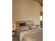 GAUDÍ Double bed with upholstered headboard By Flou