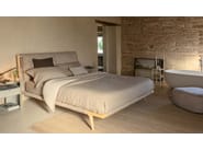 GAUDÍ Double bed with upholstered headboard By Flou