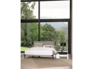 GAUDÍ Double bed with upholstered headboard By Flou