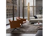 STANFORD Swivel tanned leather armchair with armrests By Poliform ...