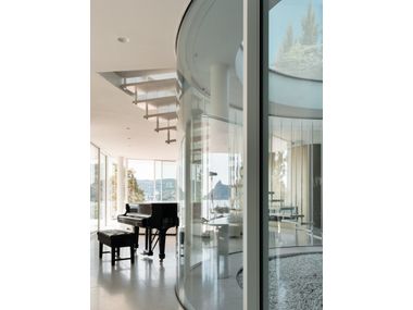 ARC Curved glass and aluminium sliding window By Sky-Frame