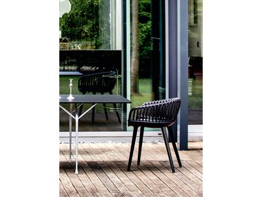 CYBORG CLUB Woven wicker chair with armrests By Magis