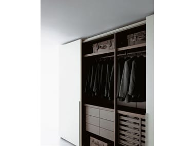 STORAGE SLIDING Sectional wardrobe with sliding doors custom By Porro ...