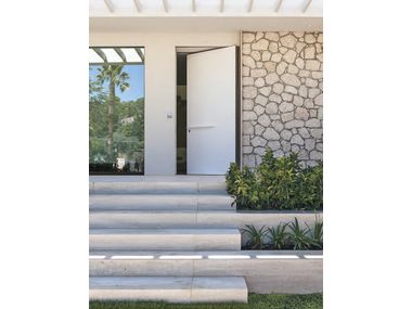 SYNUA Pivot Corian® safety door By Oikos