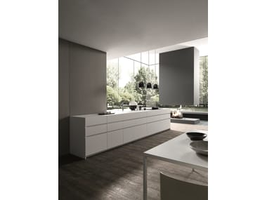 FLY Corian® kitchen with peninsula By MODULNOVA | design Andrea Bassanello
