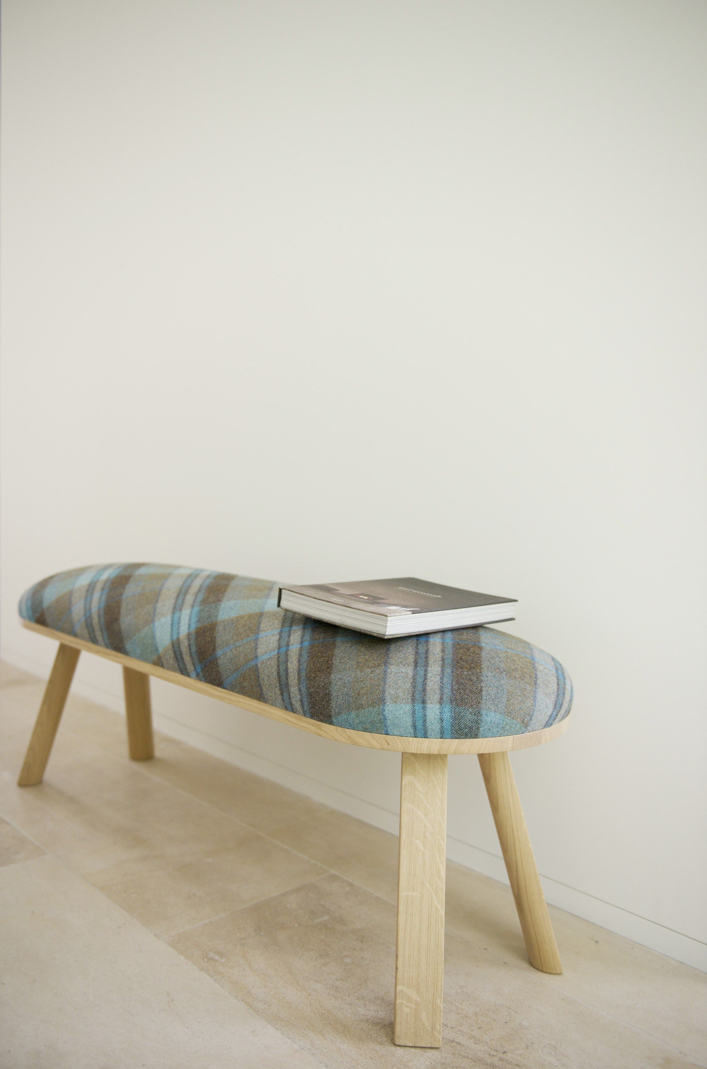 BuzziMilk Upholstered low wooden stool By BuzziSpace