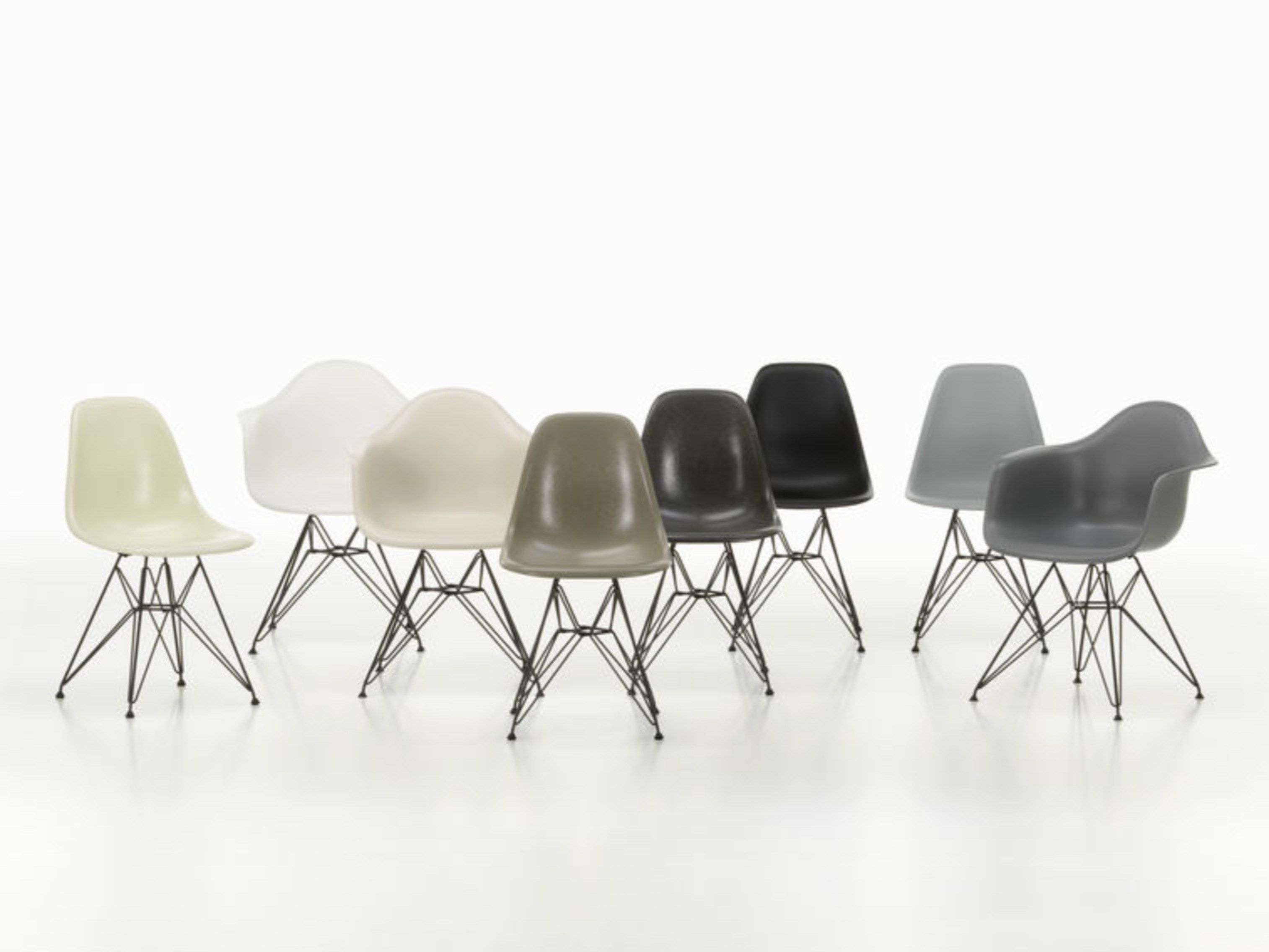 DAR Polypropylene chair with armrests By Vitra | design Charles & Ray Eames